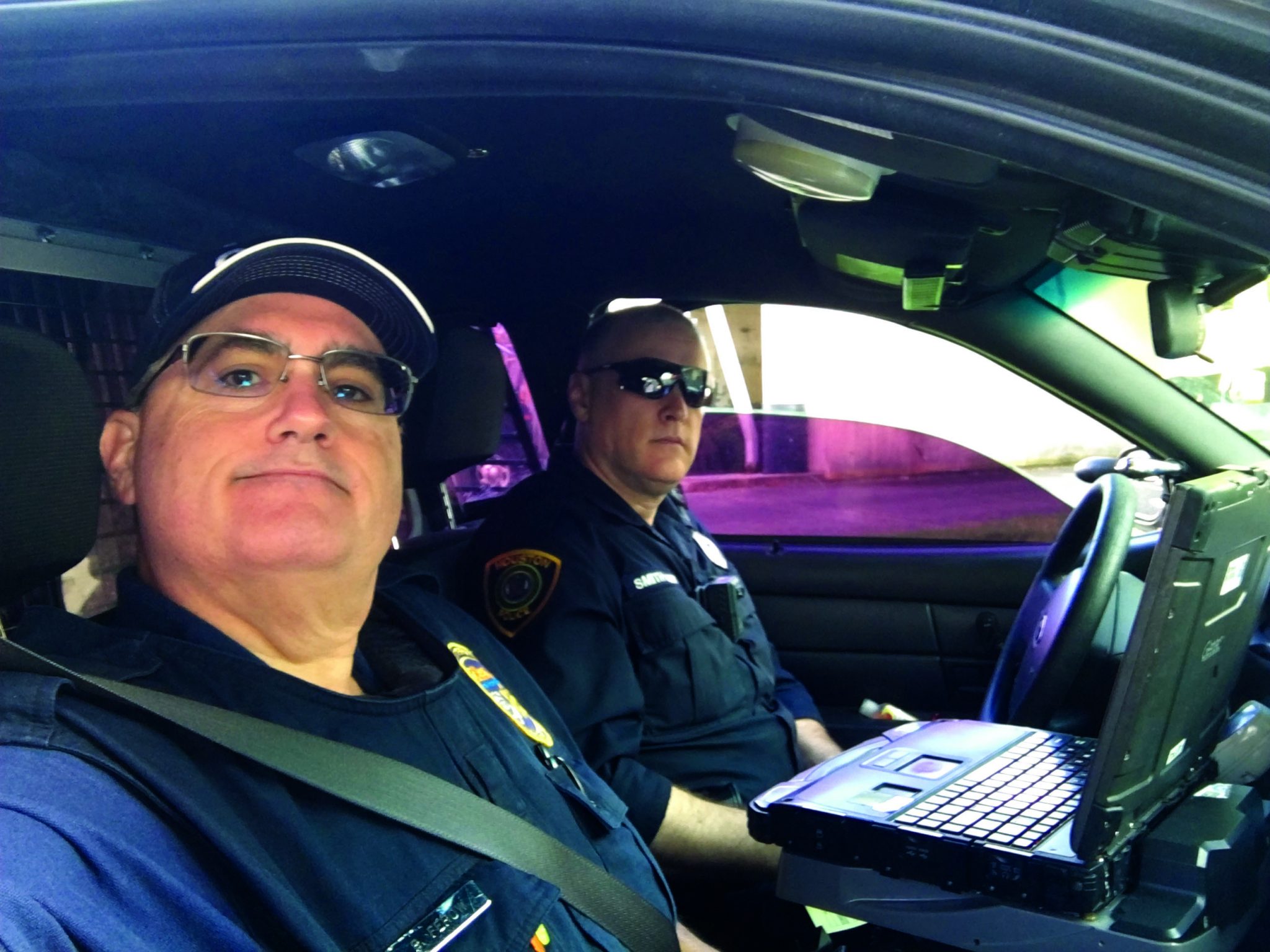 Houston Officers in cruiser - Police Chief Magazine